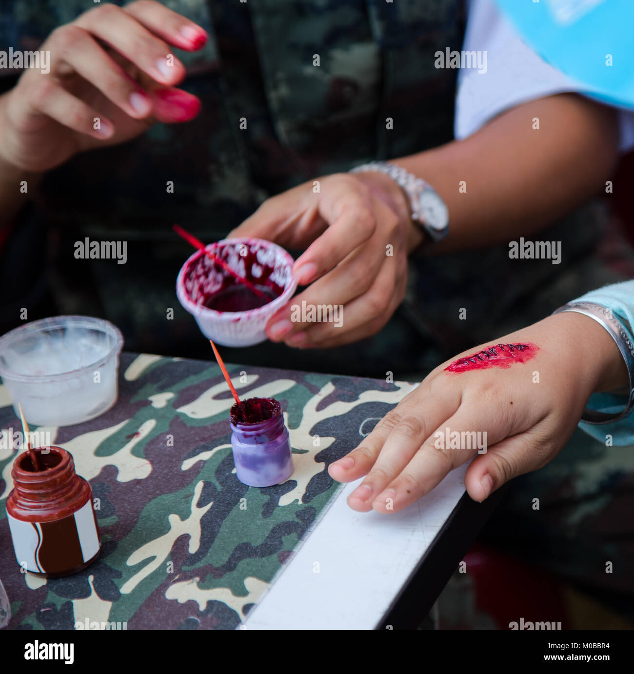Thai Army makeup fake wound on hand Stock Photo - Alamy
