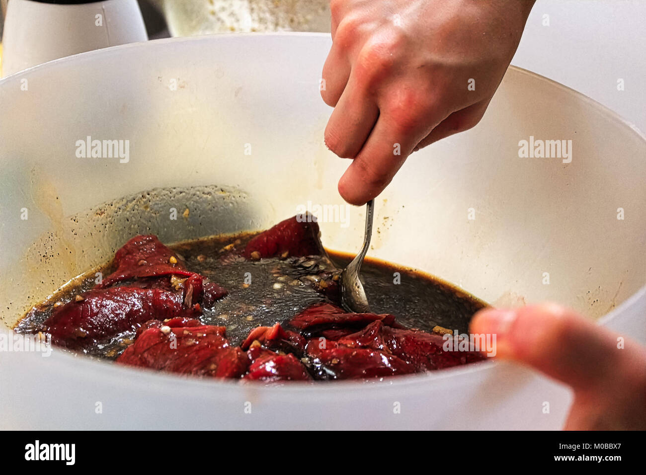 Mixing a batch of meat marinading for jerky Stock Photo - Alamy