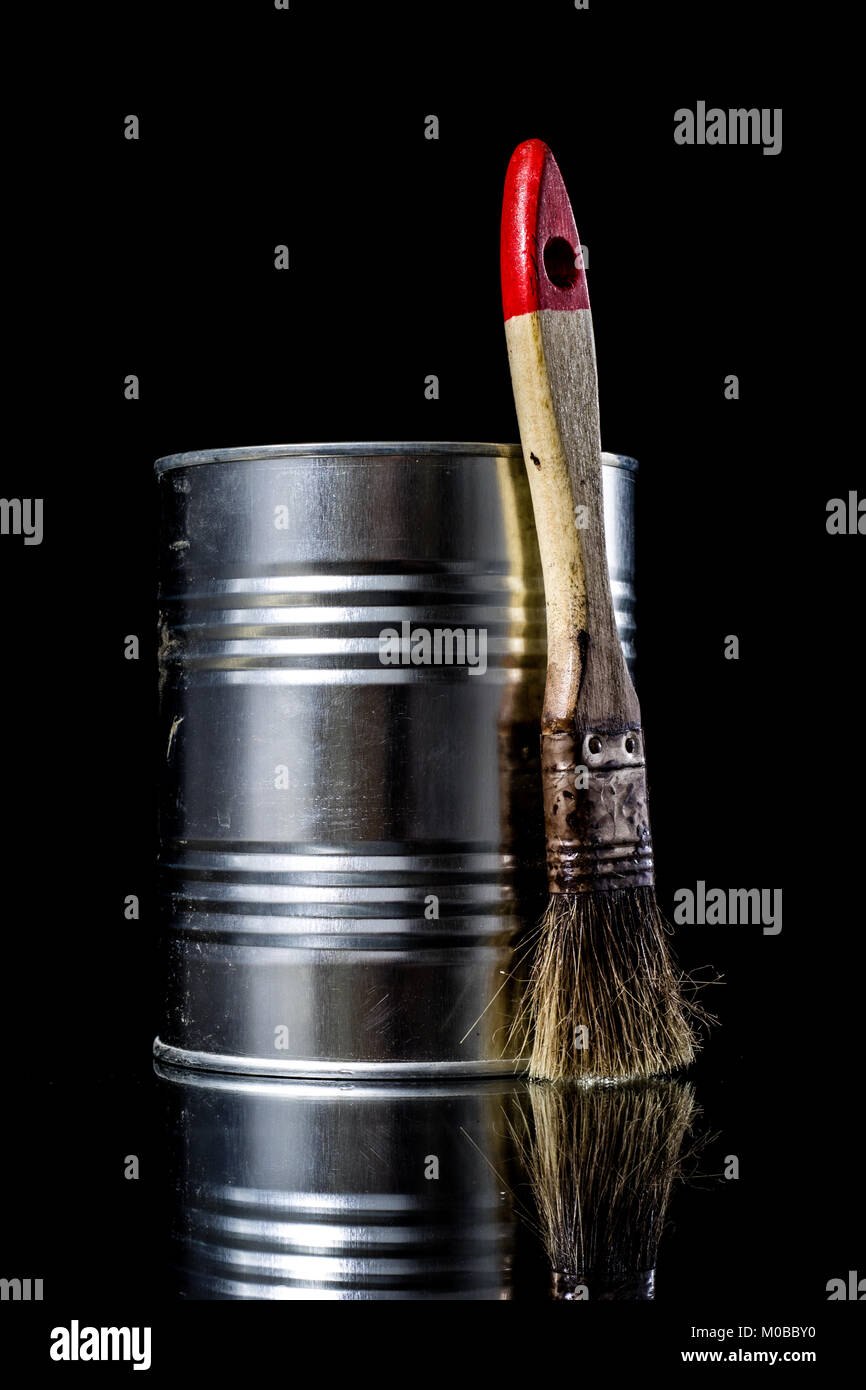 A paintbrush for a painter on a glass table. Painting accessories in a ...