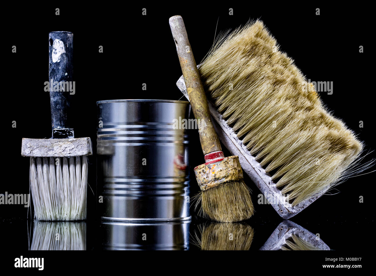 A paintbrush for a painter on a glass table. Painting accessories in a ...