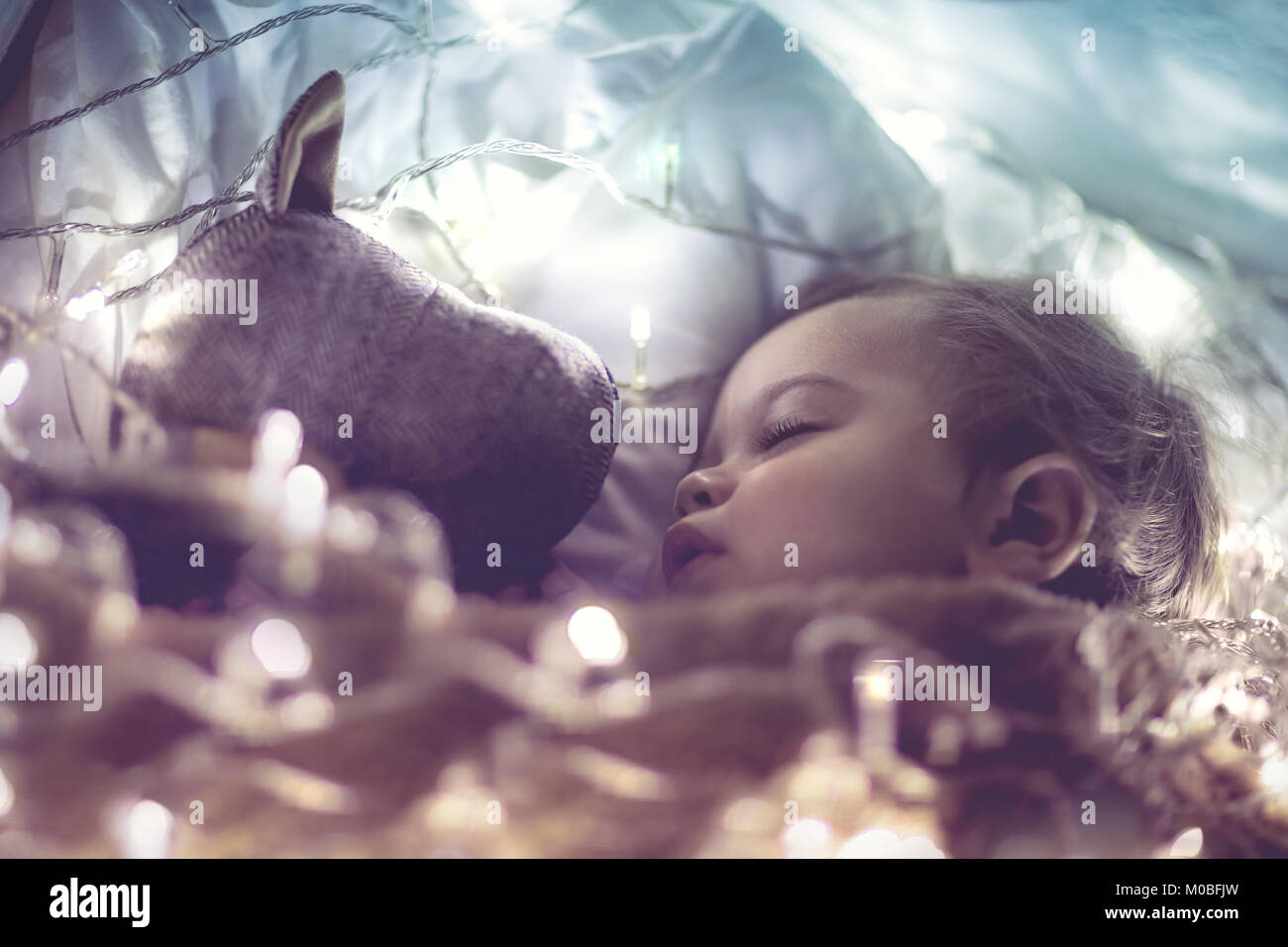 Sweet little baby boy sleeping with favourite soft toy, dreaming at ...