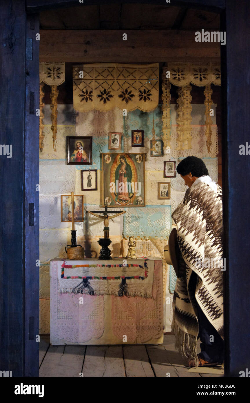 Man inside small home mexican church Stock Photo - Alamy