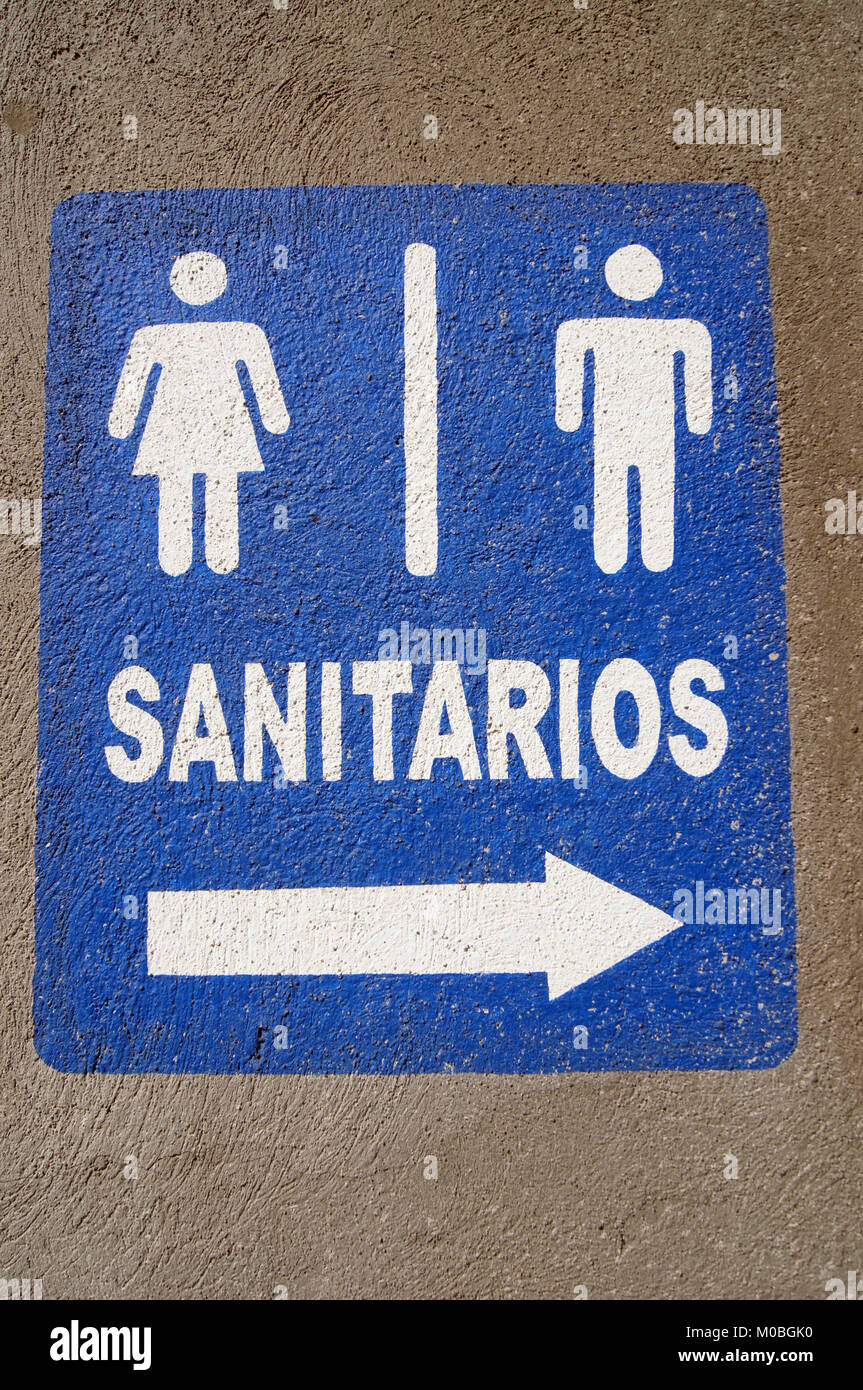 Sing with direction to the toilet on the gray wall in Mexico Stock ...