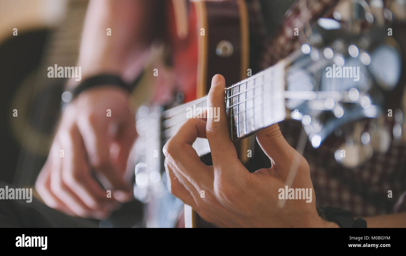Male musician plays the guitar, hands close up Stock Photo - Alamy