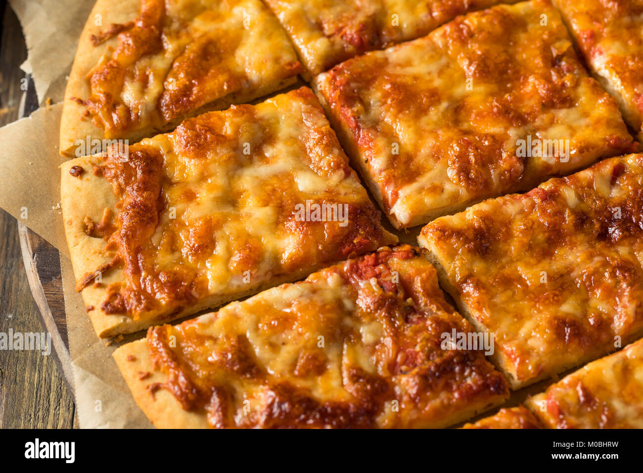 Delicious Homemade Cheese PIzza Cut into Square Slices Stock Photo - Alamy