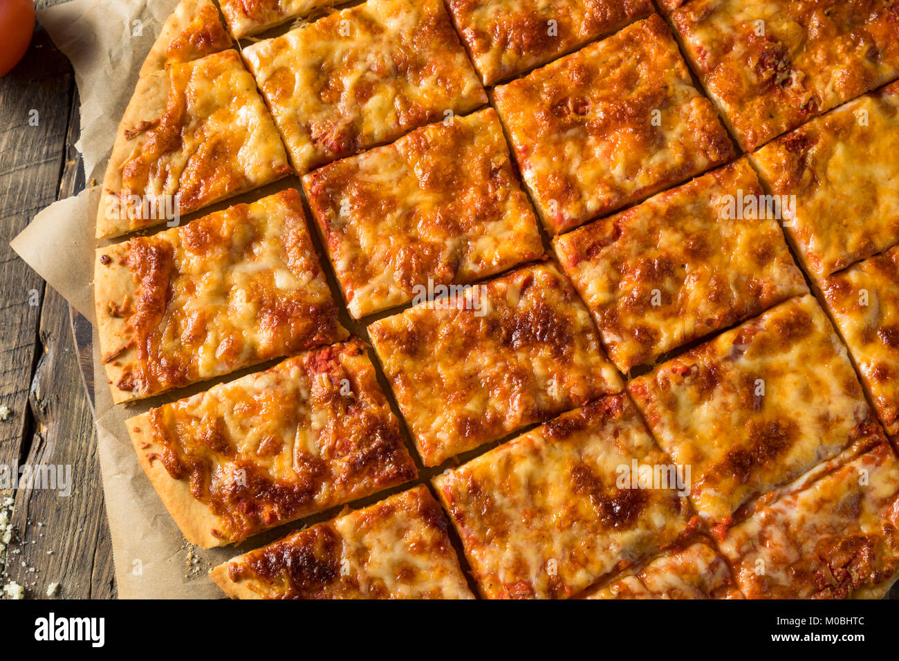 Delicious Homemade Cheese PIzza Cut into Square Slices Stock Photo - Alamy