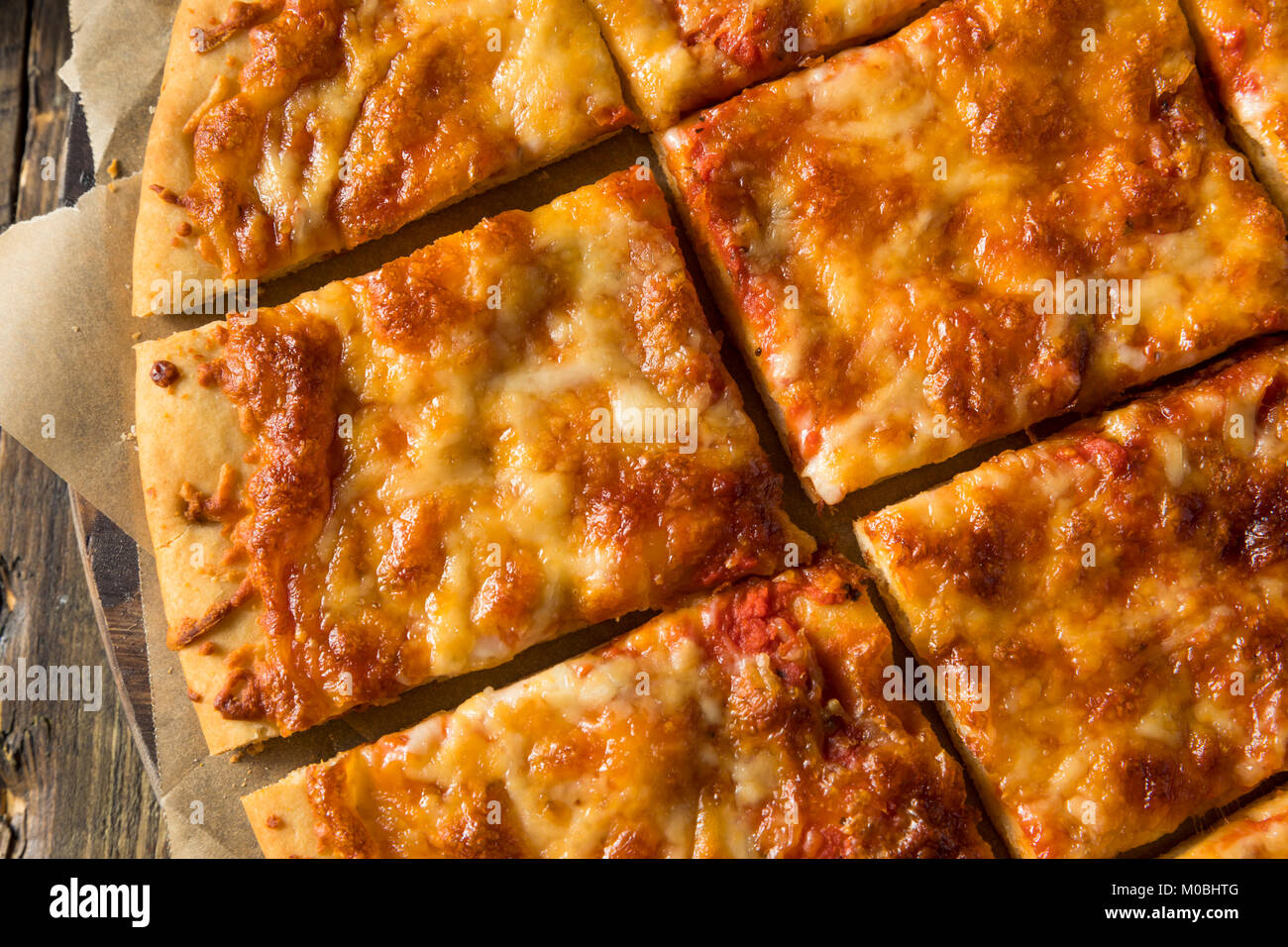Delicious Homemade Cheese PIzza Cut into Square Slices Stock Photo - Alamy