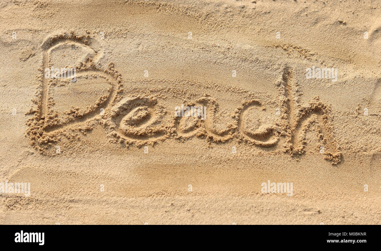 Beach - sand writing on the beach Stock Photo - Alamy