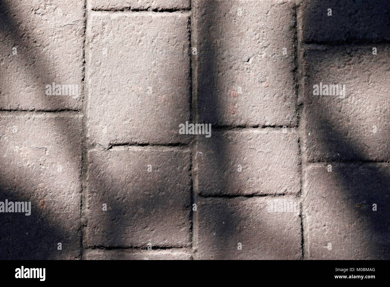 Light and shadow on the brick wall Stock Photo - Alamy