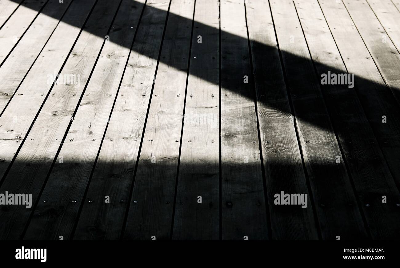 Light and shadow on old wood floor Stock Photo - Alamy