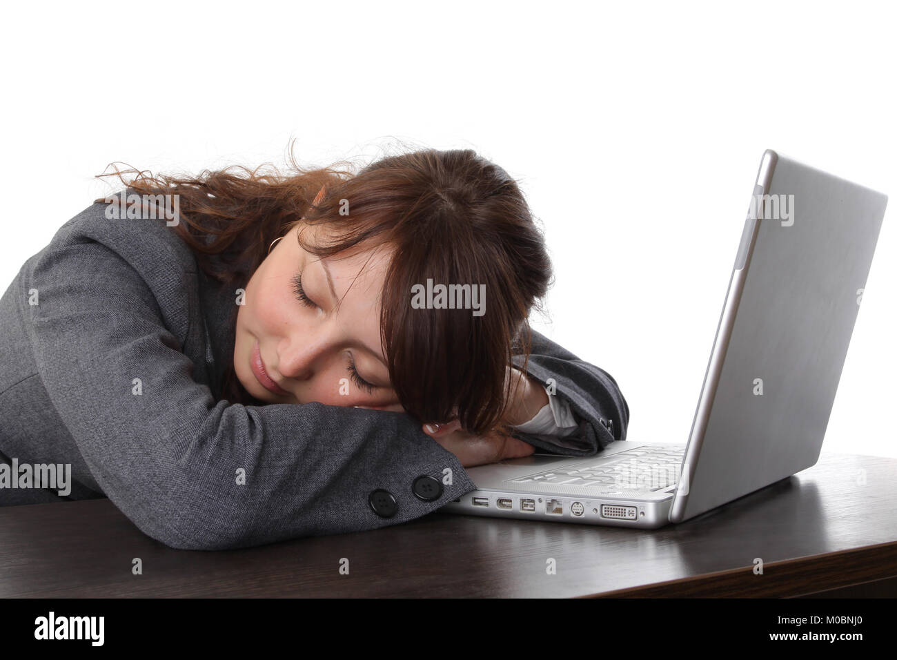 Tired woman sleeping in front of the computer isolated on white Stock ...