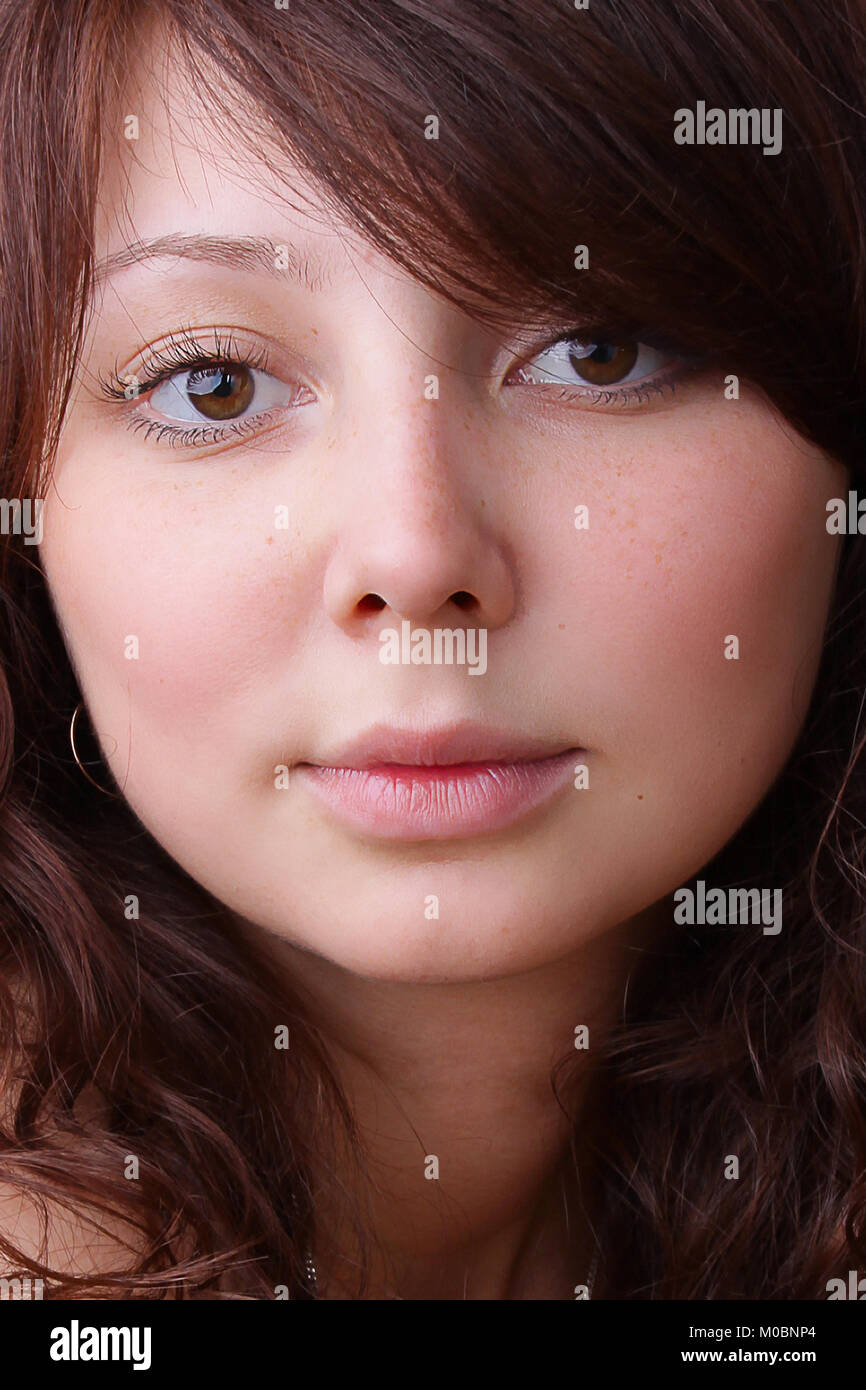 Beautiful young woman face. Close up Stock Photo - Alamy