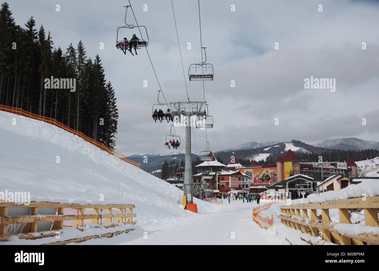 Bukovel, Ukraine - February 23, 2013: Skiers get to the mountain using ...