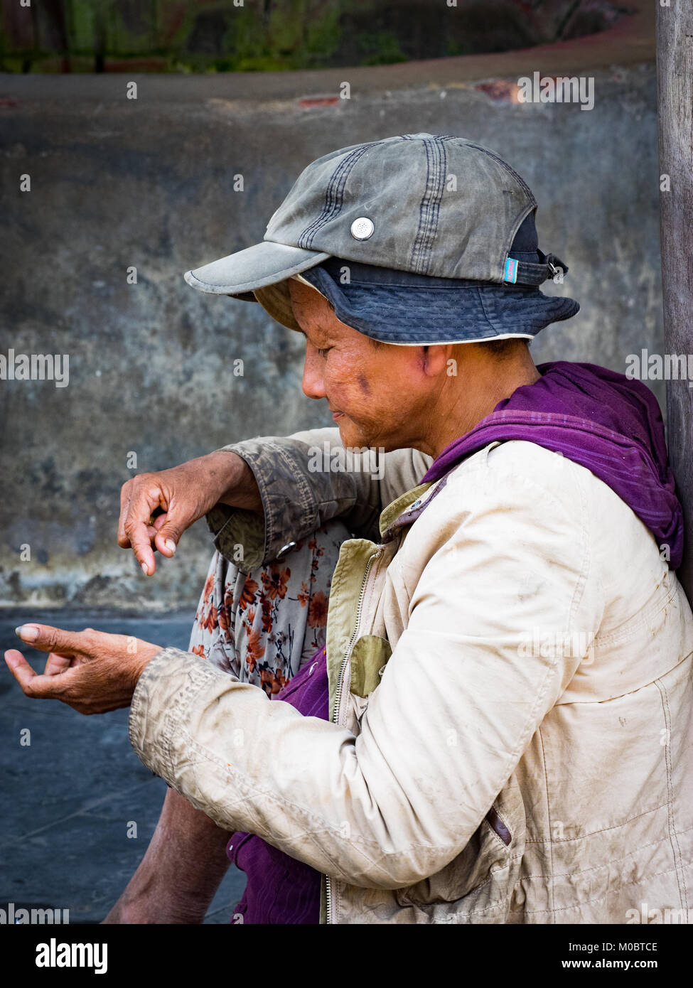 Mentally ill lady begging on the streets of Hoi An Stock Photo - Alamy