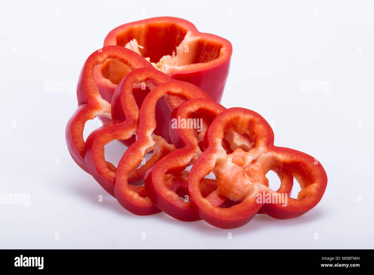 Sliced red pepper isolated on white background Stock Photo - Alamy