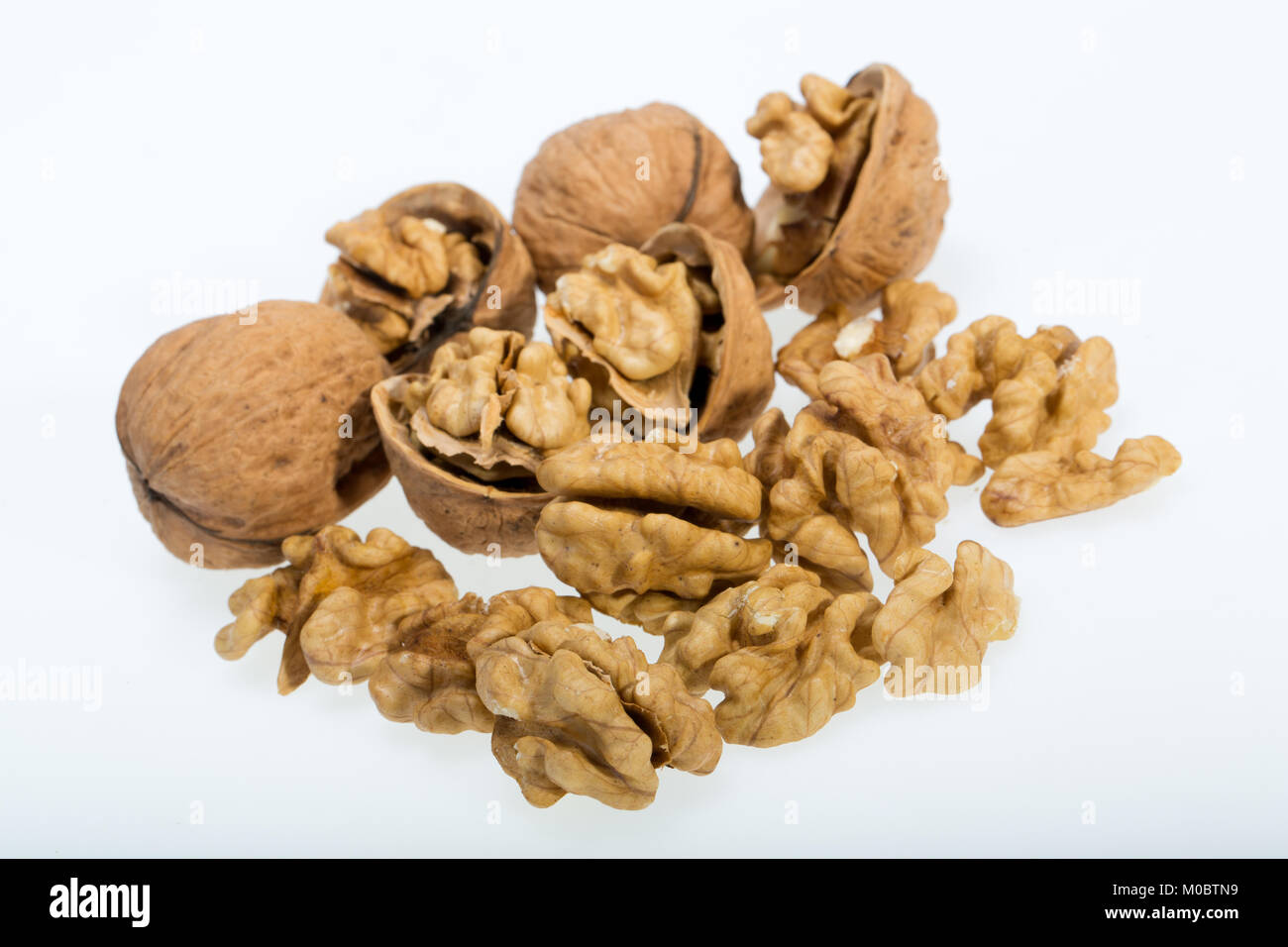 walnut and a cracked walnut isolated on the white background Stock ...