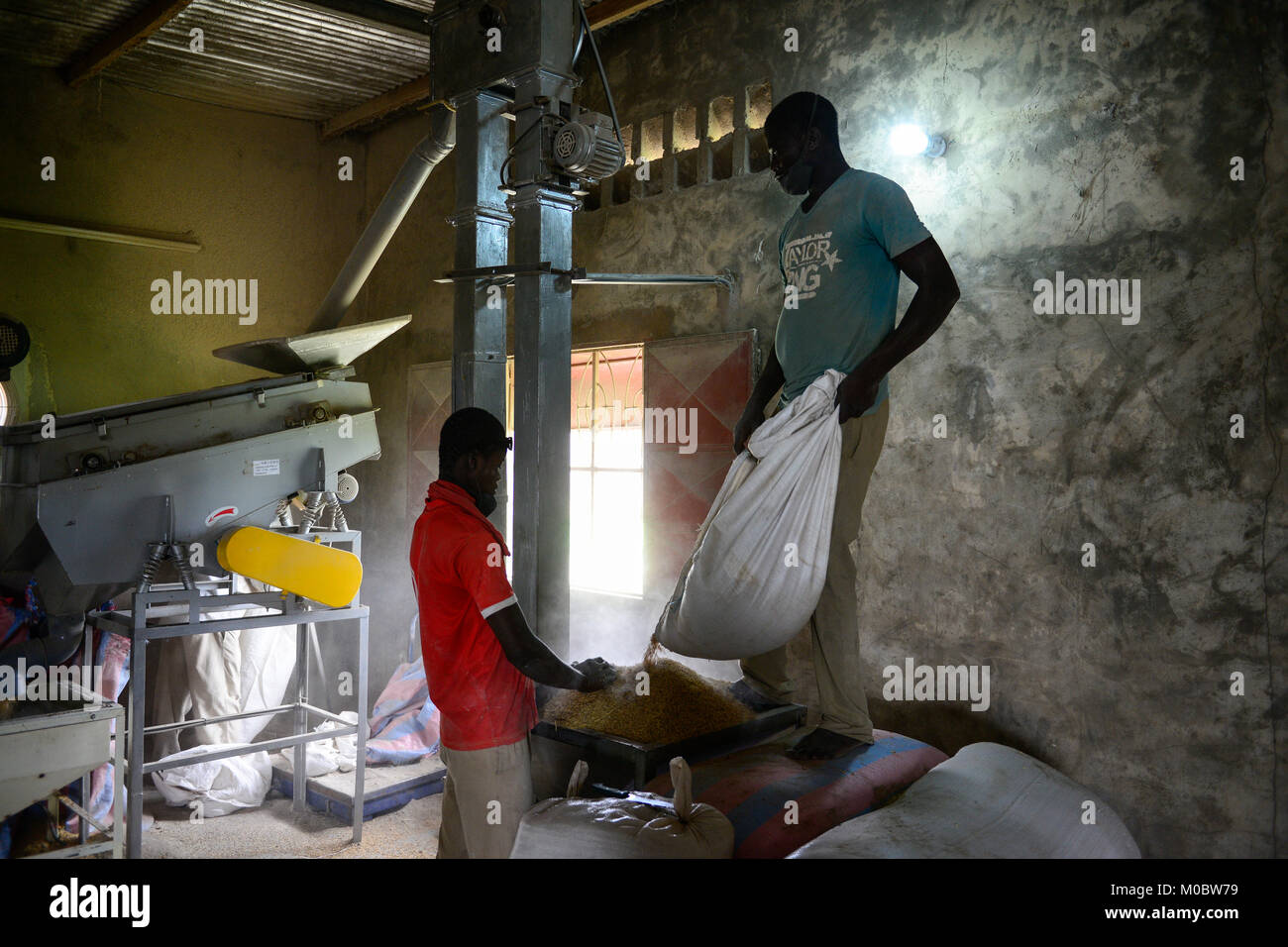 BURKINA FASO, Bobo Dioulasso, village Bama, small rice mill / Dorf Bama ...