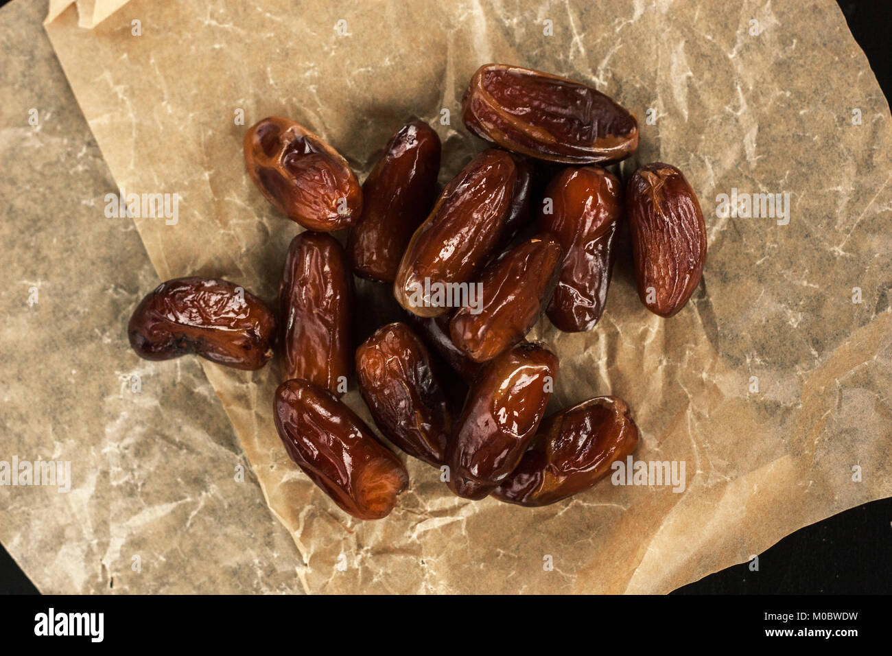 The dates lie on the crumpled craft paper Stock Photo - Alamy