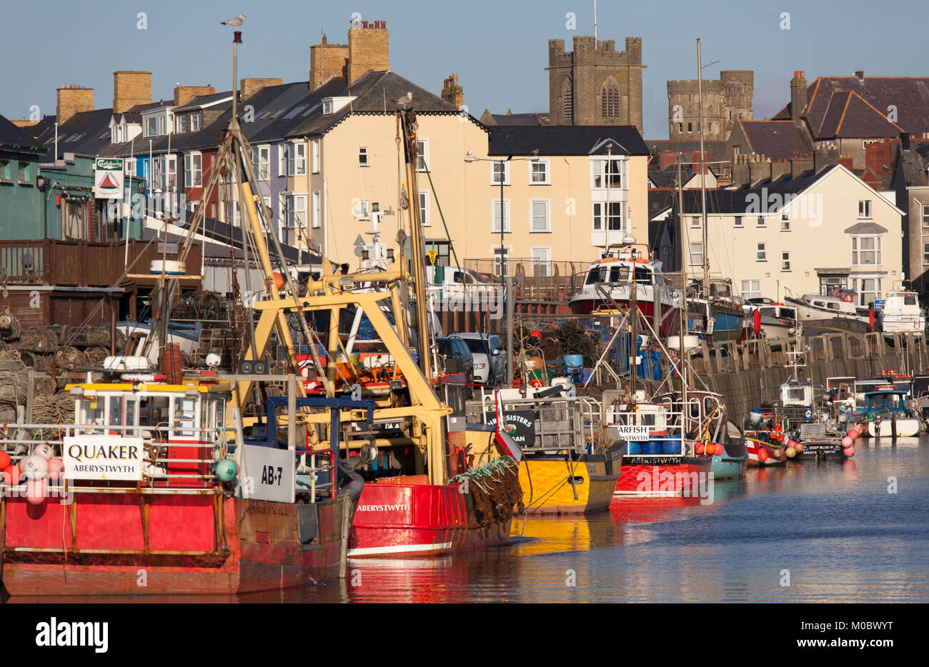 Town of Aberystwyth, Wales. Picturesque view of fishing boats berthed ...