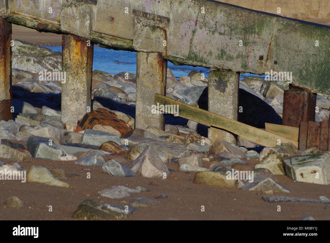 Crumbling Concrete and Iron Sea Wall Coastal Defence. Donmouth ...