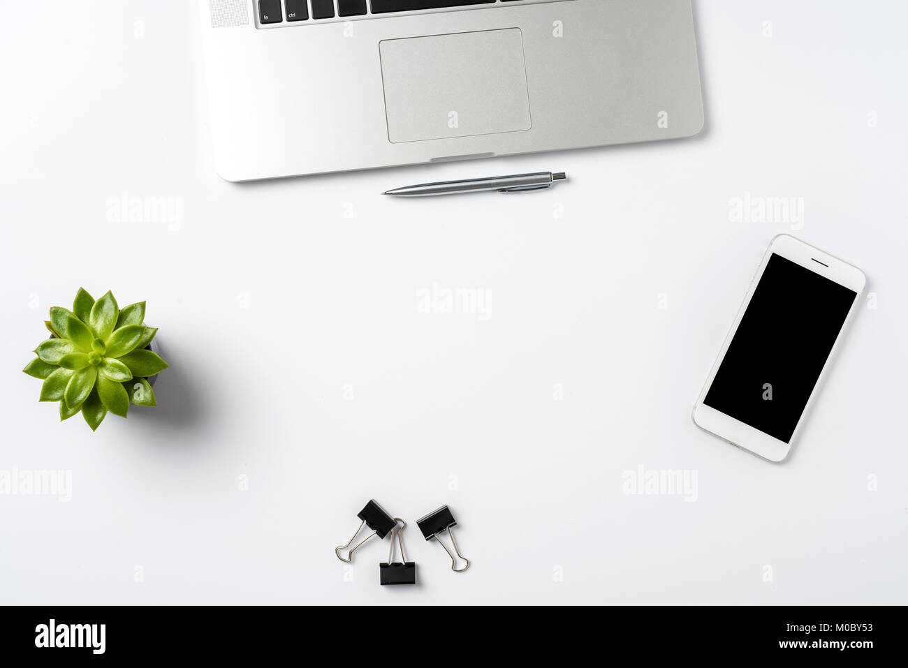 Overhead shot of office desktop with modern laptop and accessories ...