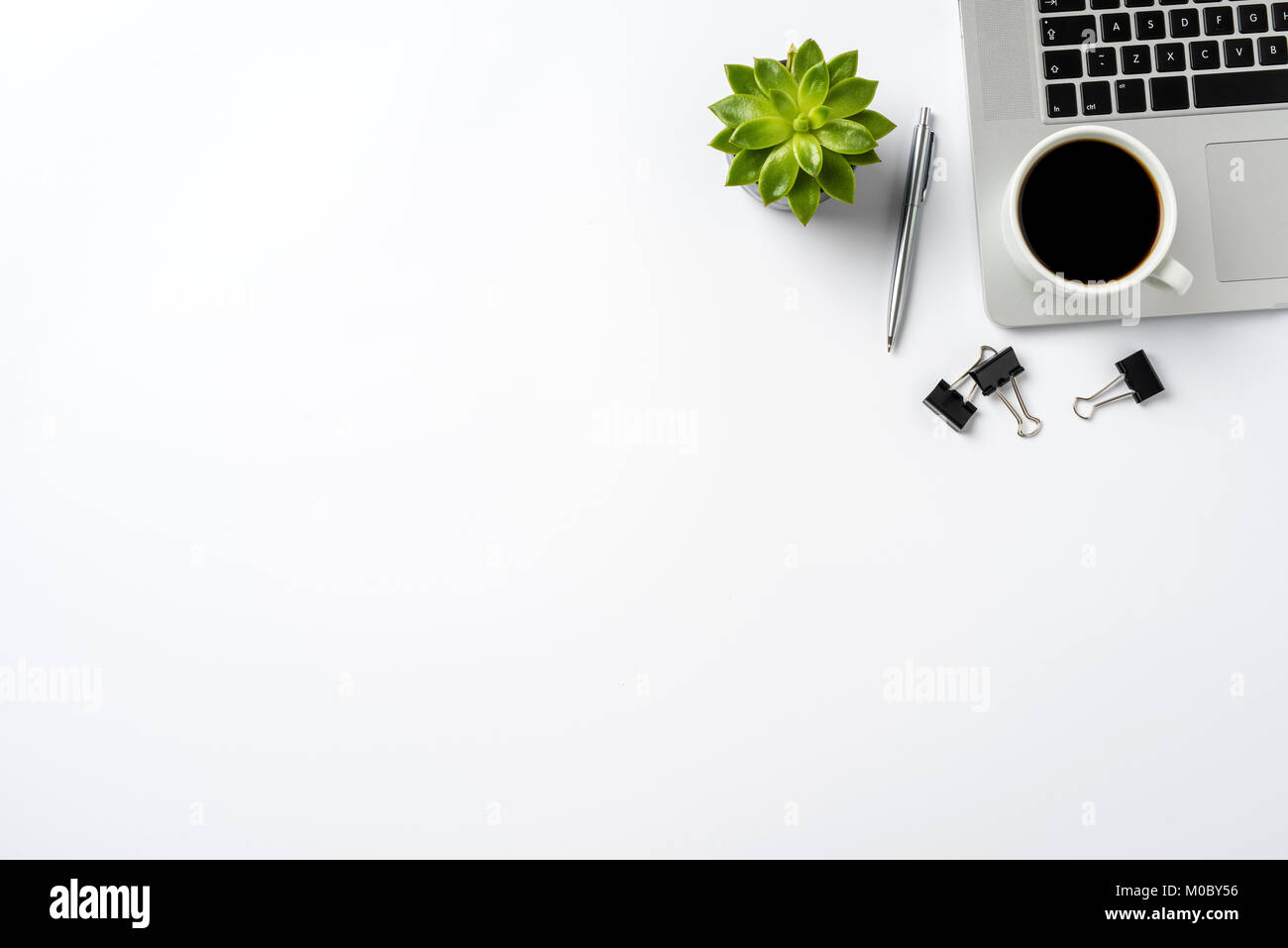 Overhead shot of office desktop with modern laptop and accessories ...