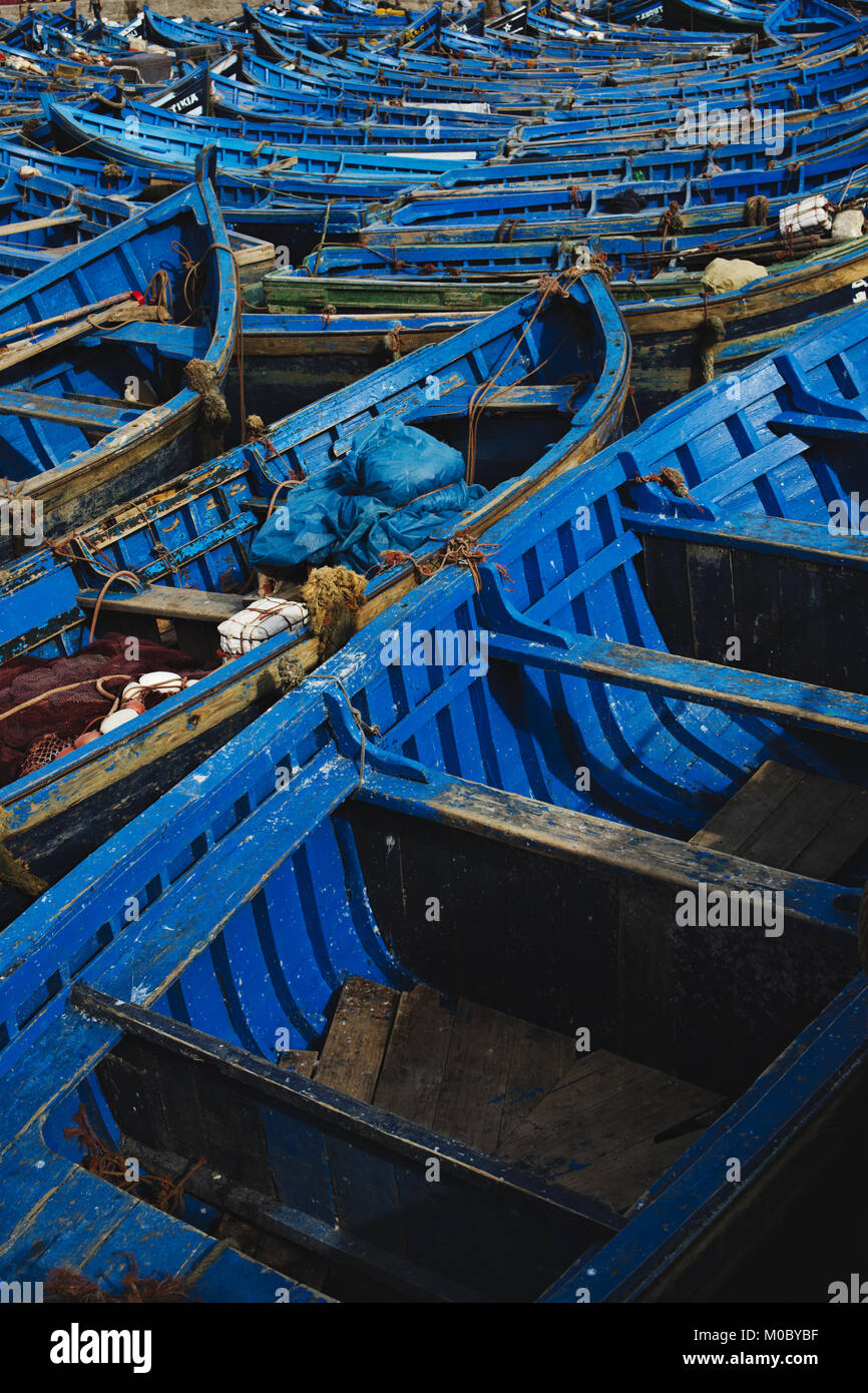 The colorful blue fishing rowboats at the Essaouira harbor Stock Photo ...