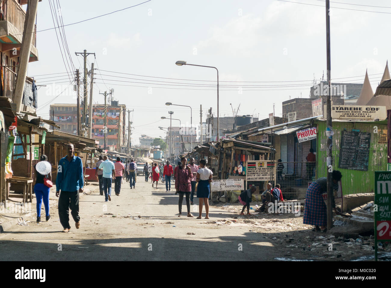 View down a road in Huruma, a district of Nairobi, showing people and ...