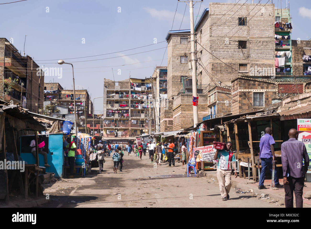 View down a road in Huruma, a district of Nairobi, showing people and ...