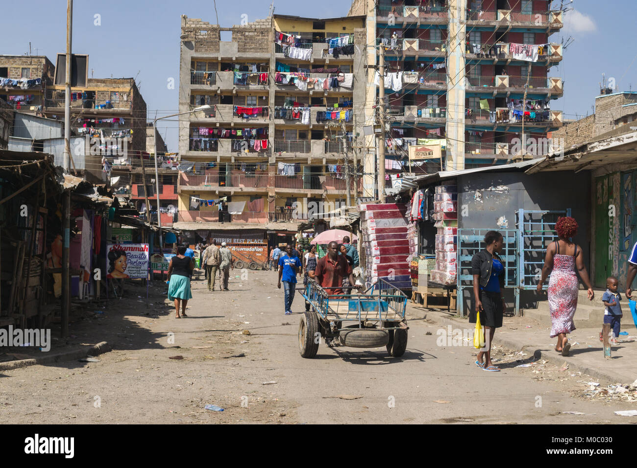View down a road in Huruma, a district of Nairobi, showing people and ...