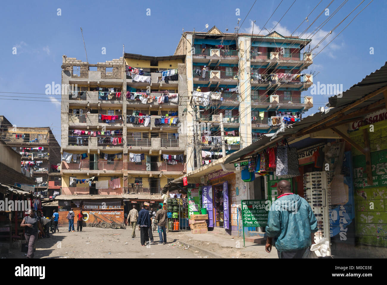 View down a road in Huruma, a district of Nairobi, showing people and ...