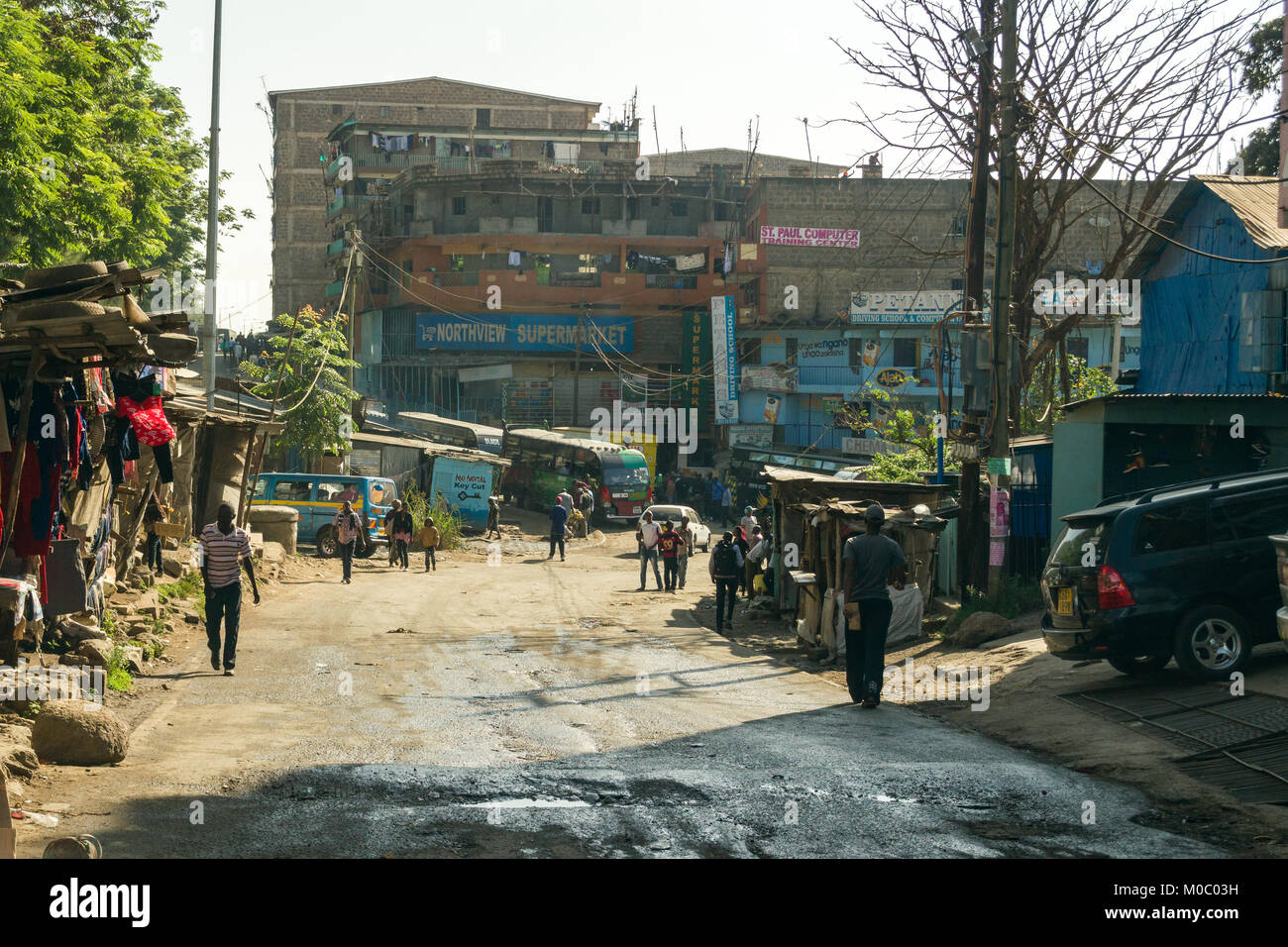 View down a road in Huruma, a district of Nairobi, showing people and ...