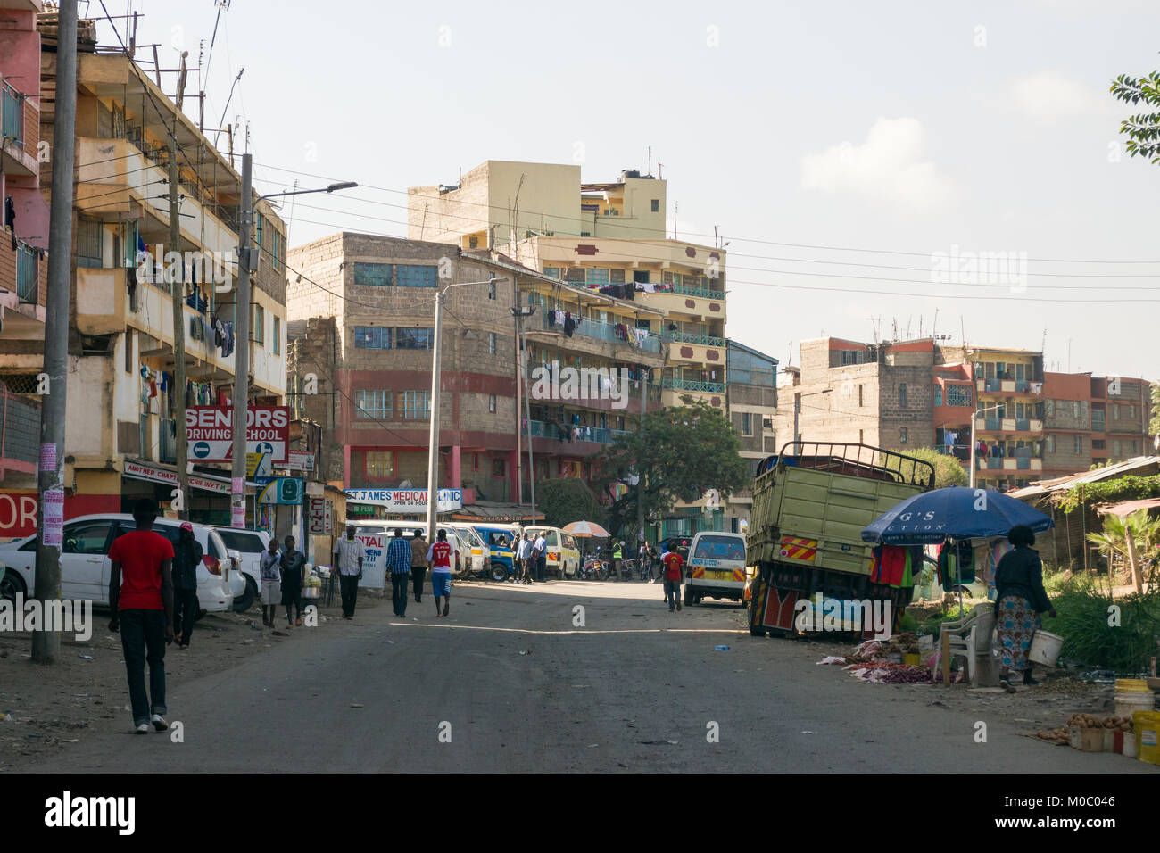 View down a road in Huruma, a district of Nairobi, showing people and ...