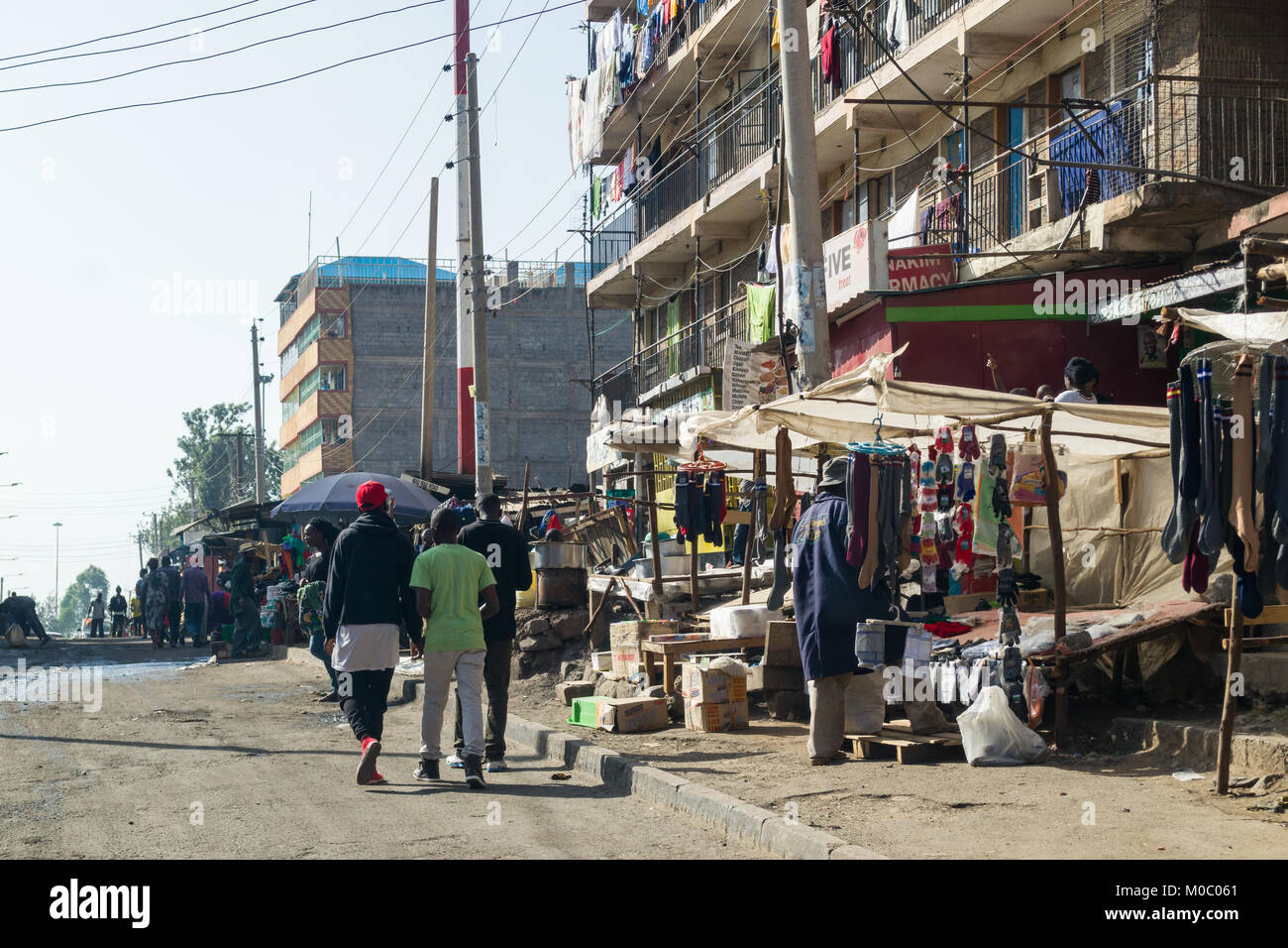 View down a road in Huruma, a district of Nairobi, showing people ...