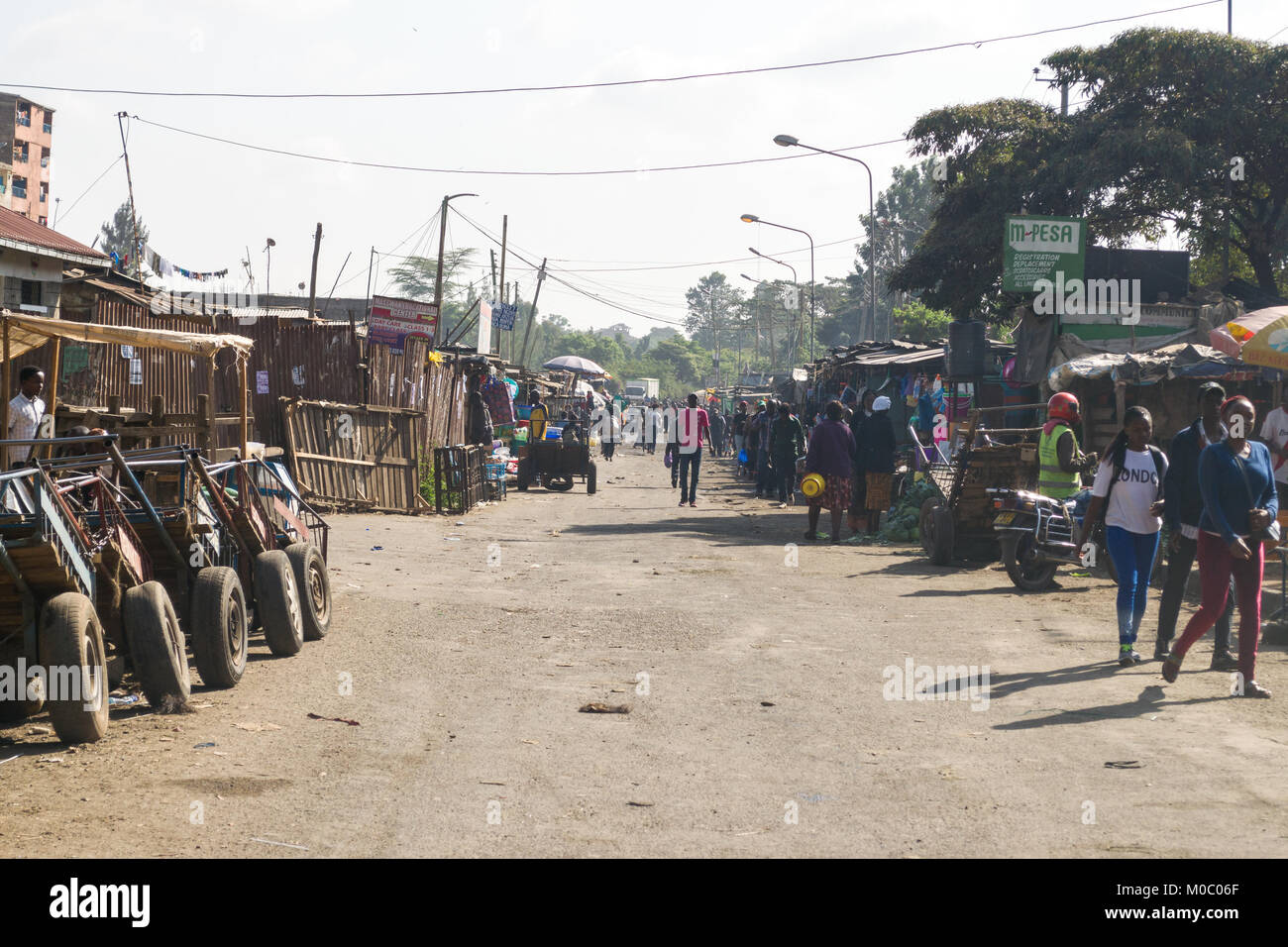 View down a road in Huruma, a district of Nairobi, showing people ...