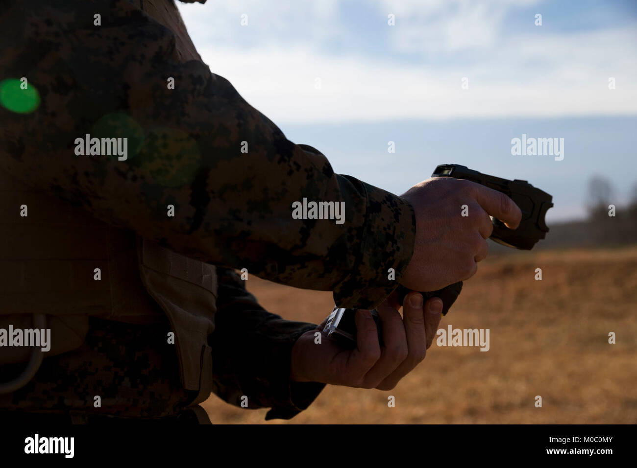U.S. Marine Corps Sgt. Jeffrey Rychener, a non-lethal weapons ...