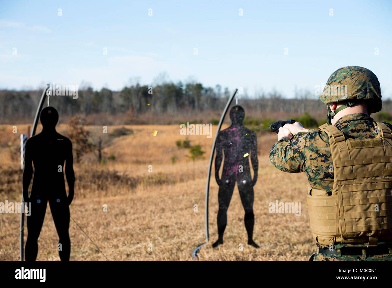 U.S. Marine Corps Sgt. Jeffrey Rychener, a non-lethal weapons ...