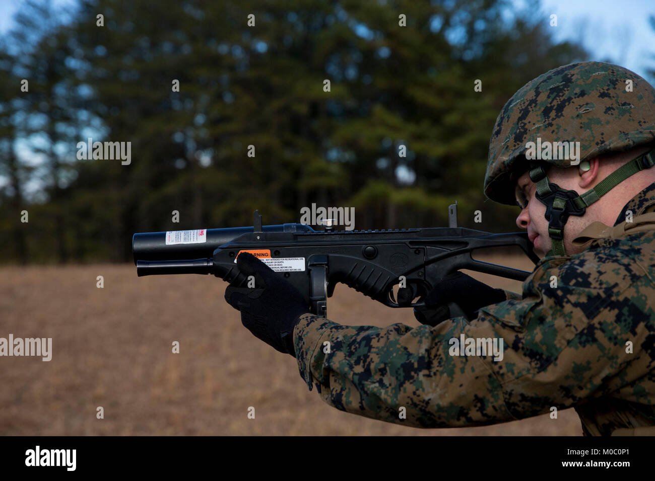 U.S. Marine Corps Sgt. Jeffrey Rychener, a non-lethal weapons ...