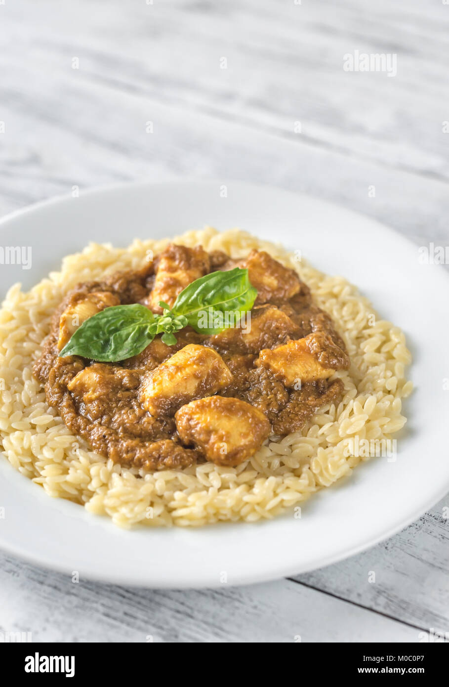 Pasta with korma sauce Stock Photo - Alamy