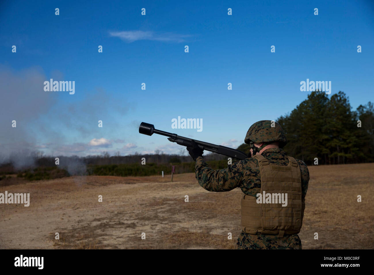 U.S. Marine Corps Sgt. Jeffrey Rychener, a non-lethal weapons ...