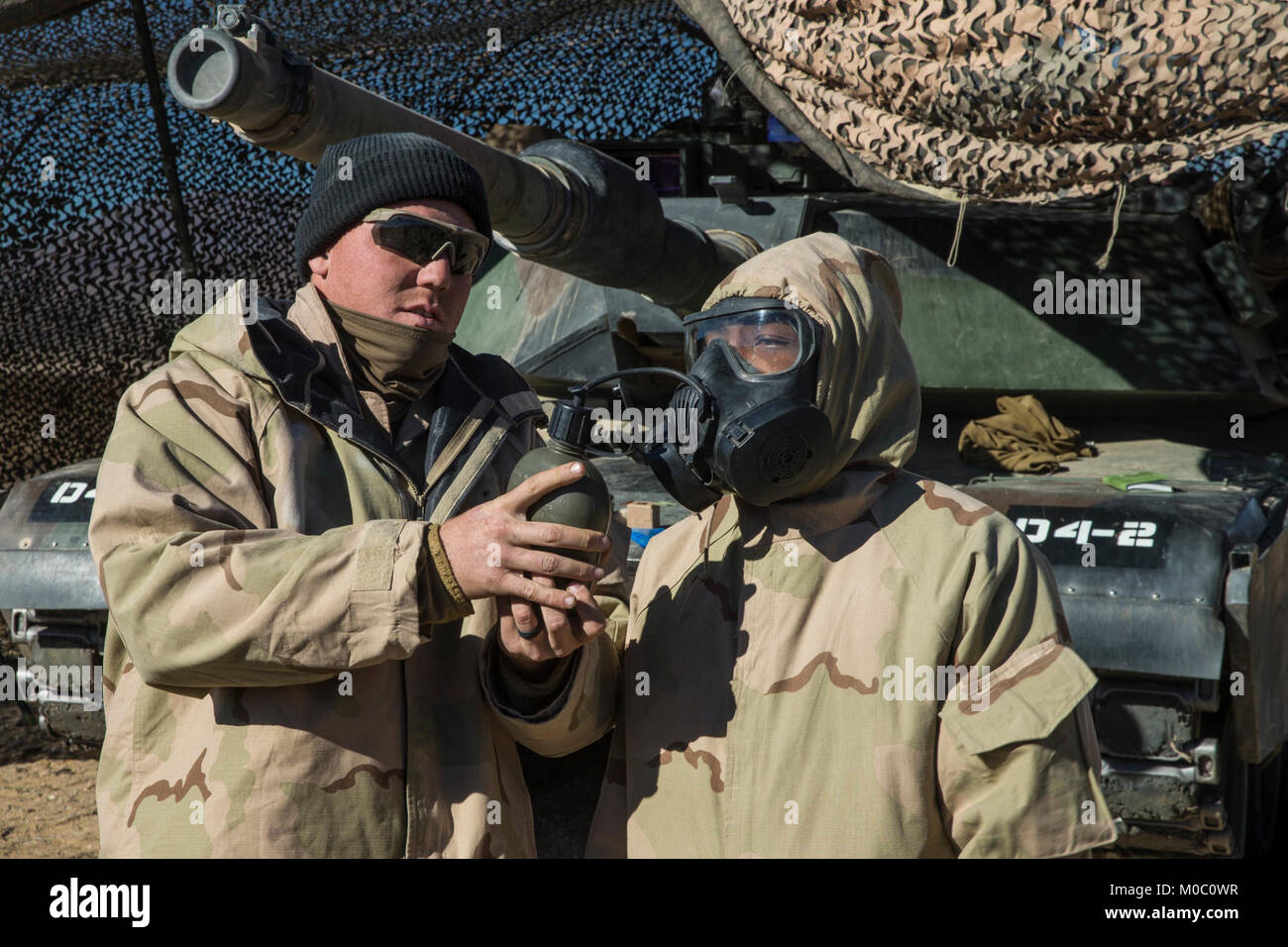 U.S. Marine Corps Sgt. Johnathon Rhodes, left, a Chemical, Biological ...