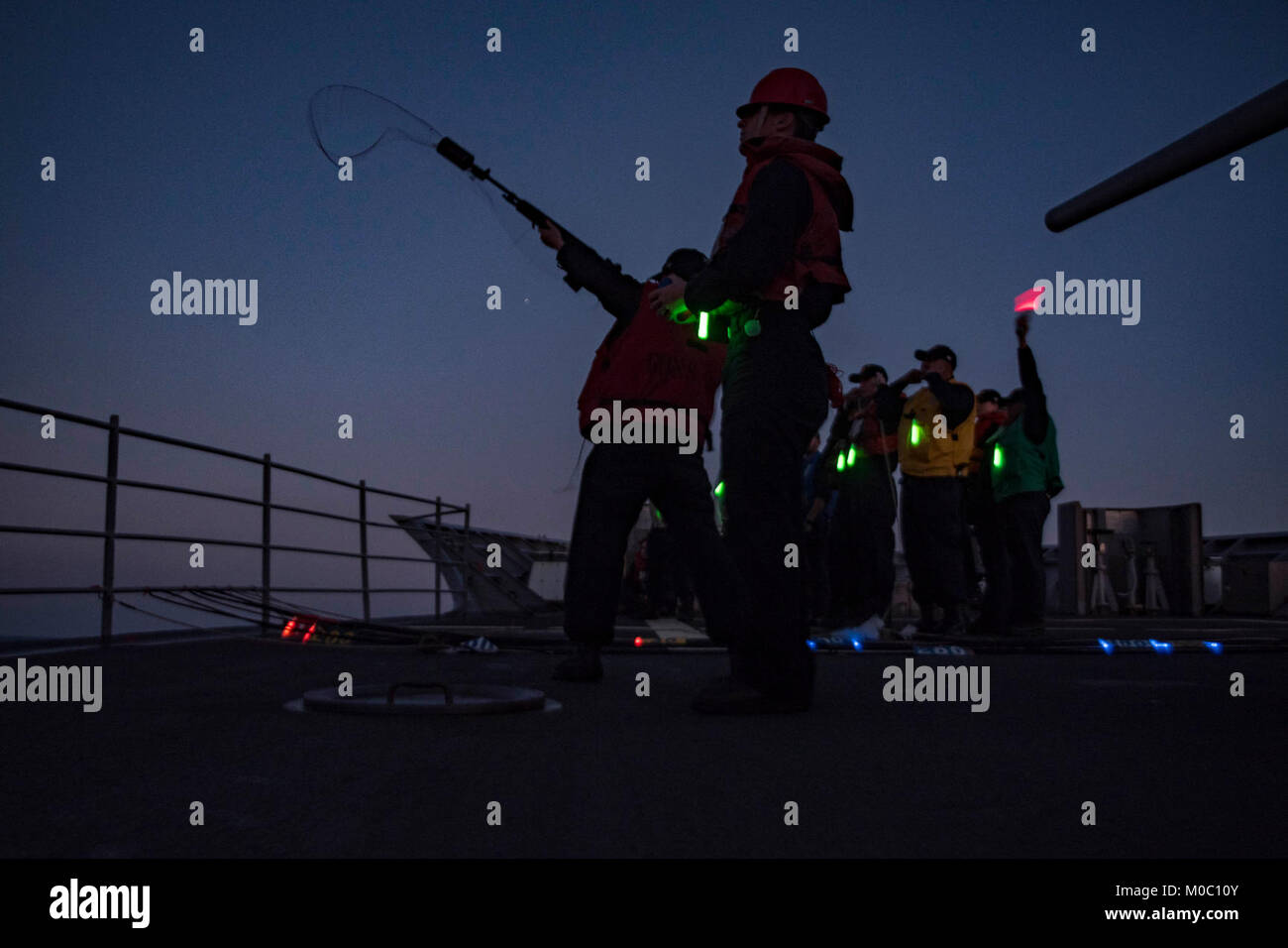 ARABIAN GULF (Dec. 12, 2017) Gunner's Mate 2nd Class Devan Vick fires a ...