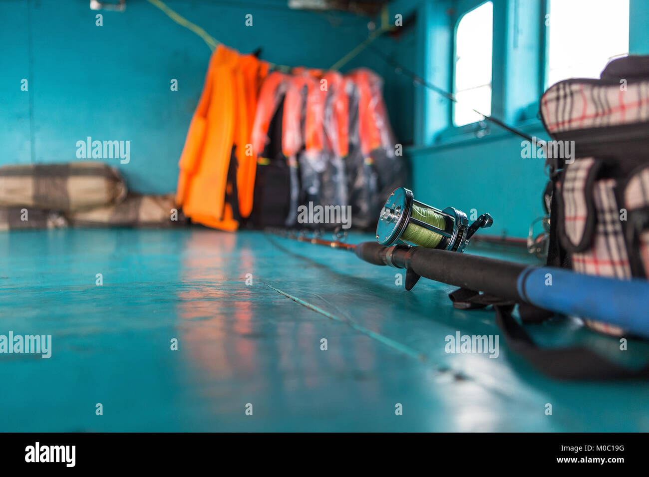 Fishing gear with life vest in the Garret on the boat Stock Photo - Alamy