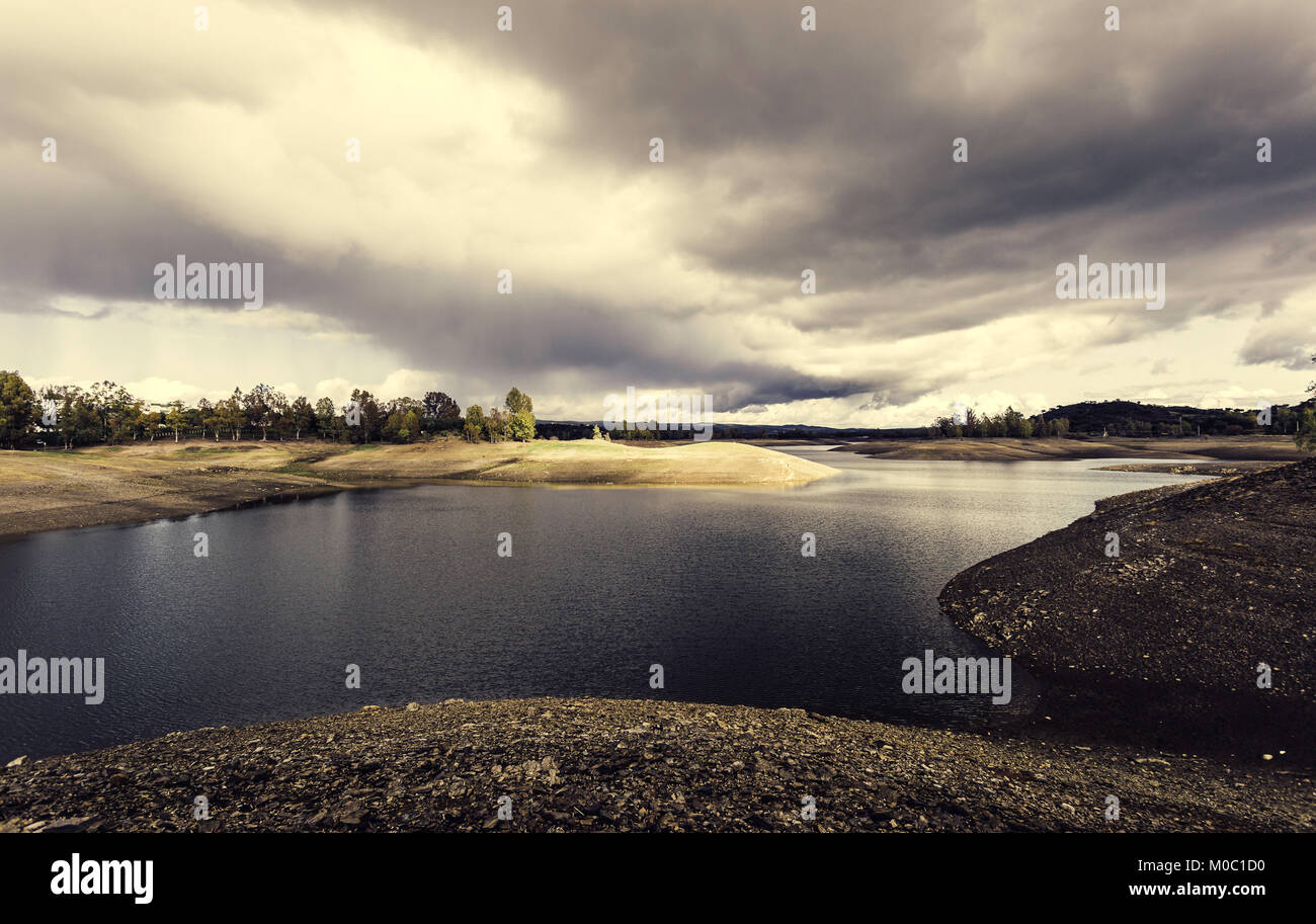 The lake between sun and shadow Stock Photo - Alamy