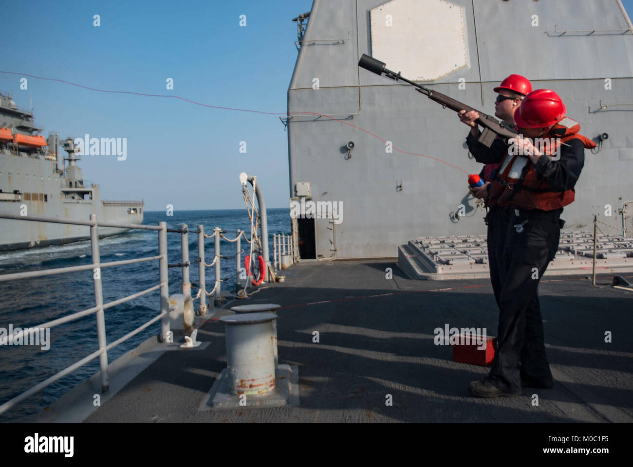 ARABIAN GULF (Jan. 5, 2018) Gunner's Mate Seaman Tyler Pilon shoots a ...