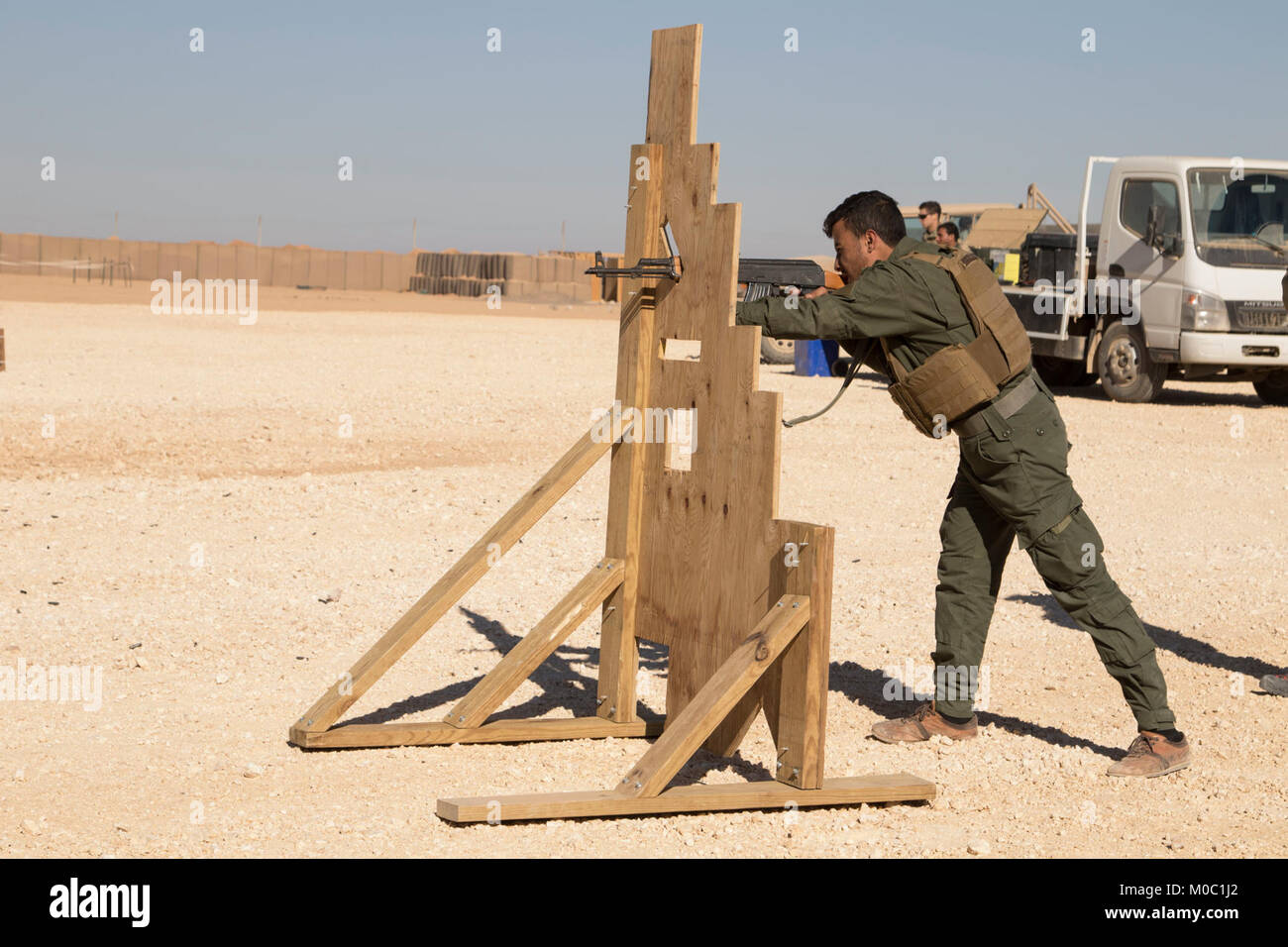 Raqqa Internal Security Force students learn how to shoot around ...