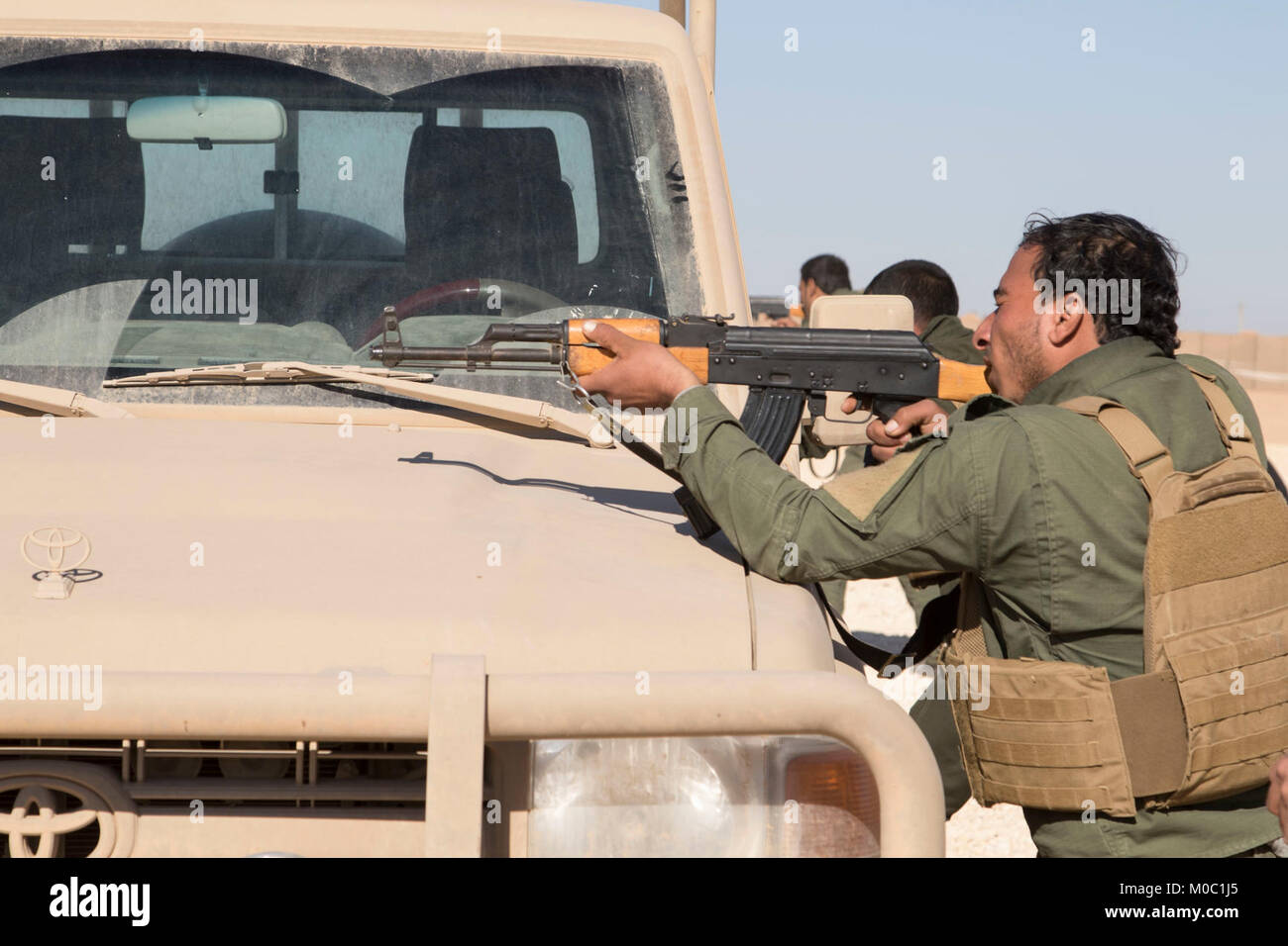 Raqqa Internal Security Force students learn how to shoot around ...