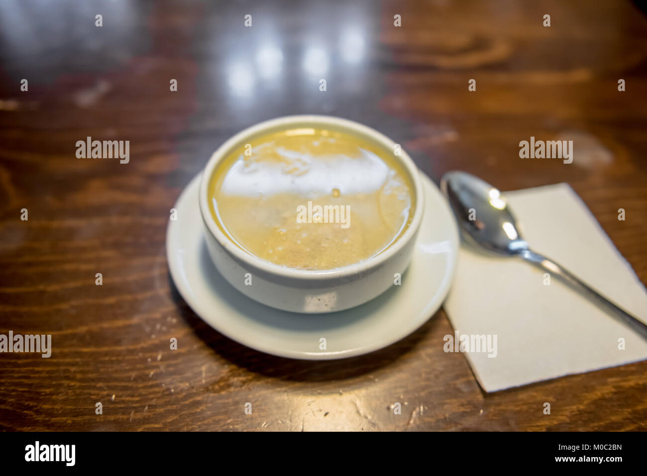 Traditional Turkish hot Tripe Soup served on wooden table Stock Photo ...