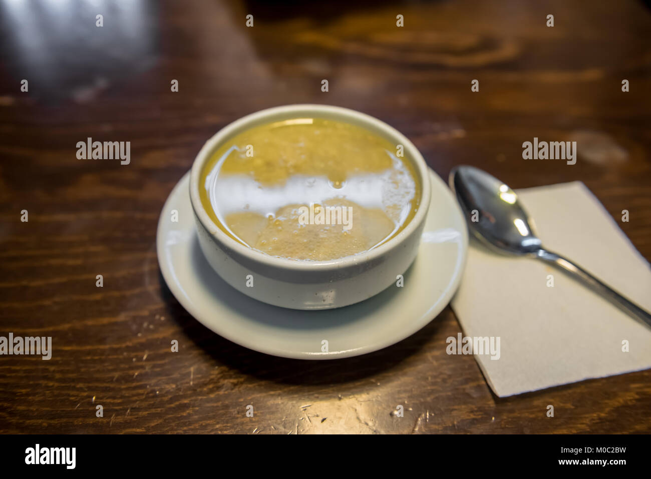 Traditional Turkish hot Tripe Soup served on wooden table Stock Photo ...