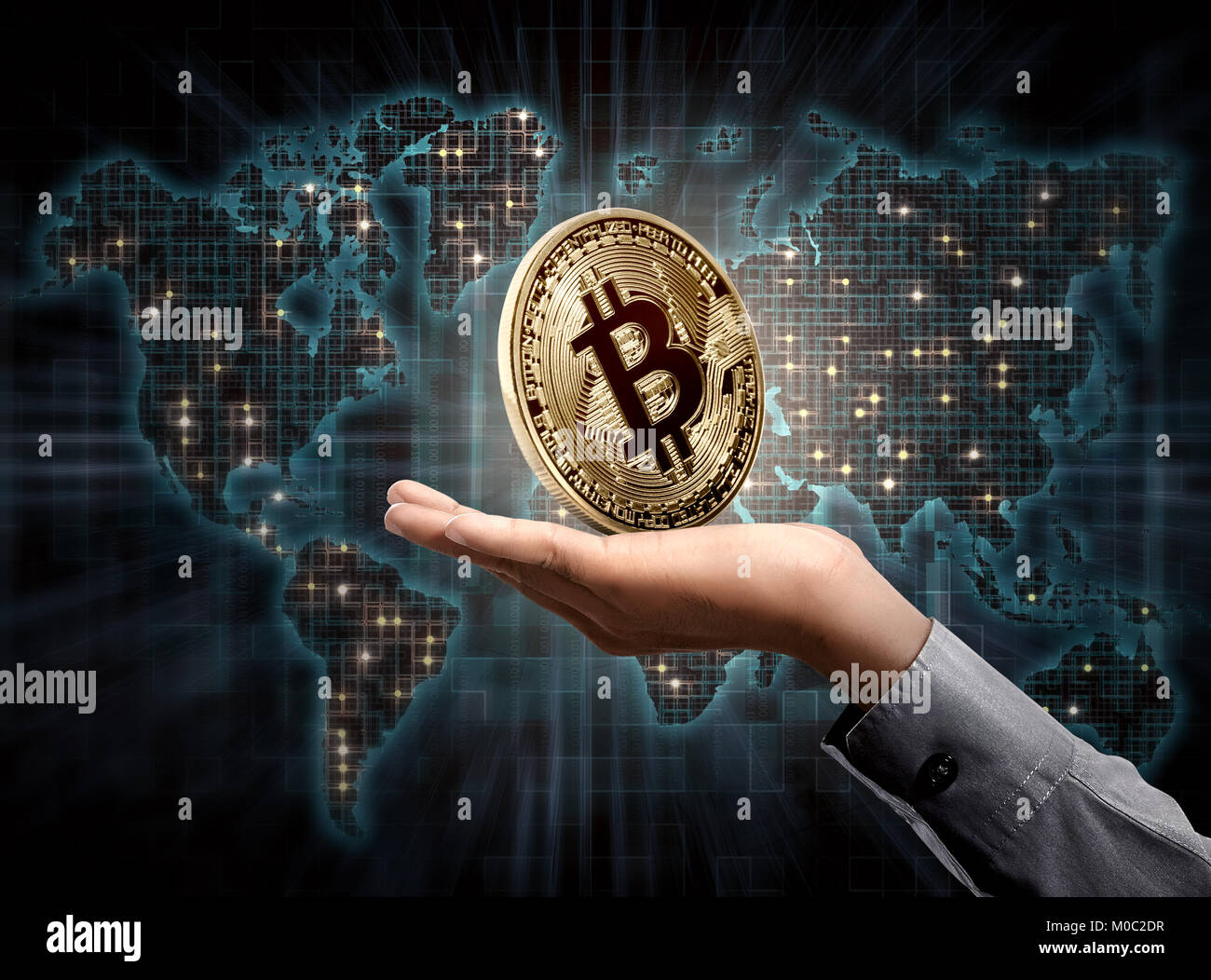 People with golden bitcoin on his hands with digital world map ...